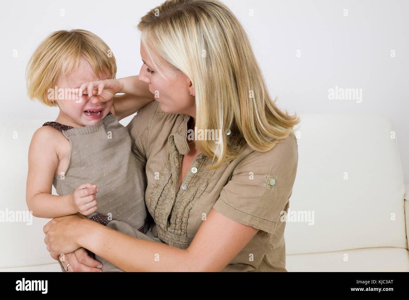 Mother Soothing Crying Child Stock Photo - Alamy
