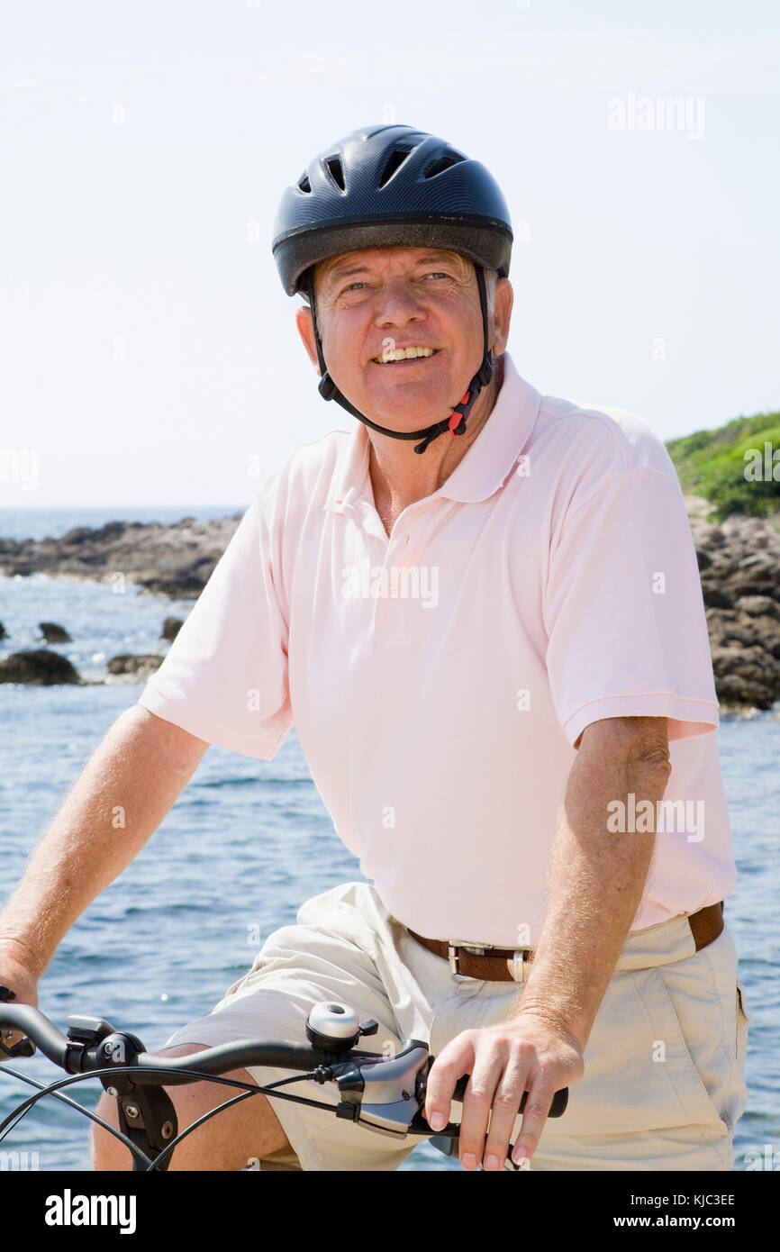 Man on Bicycle by Water Stock Photo - Alamy
