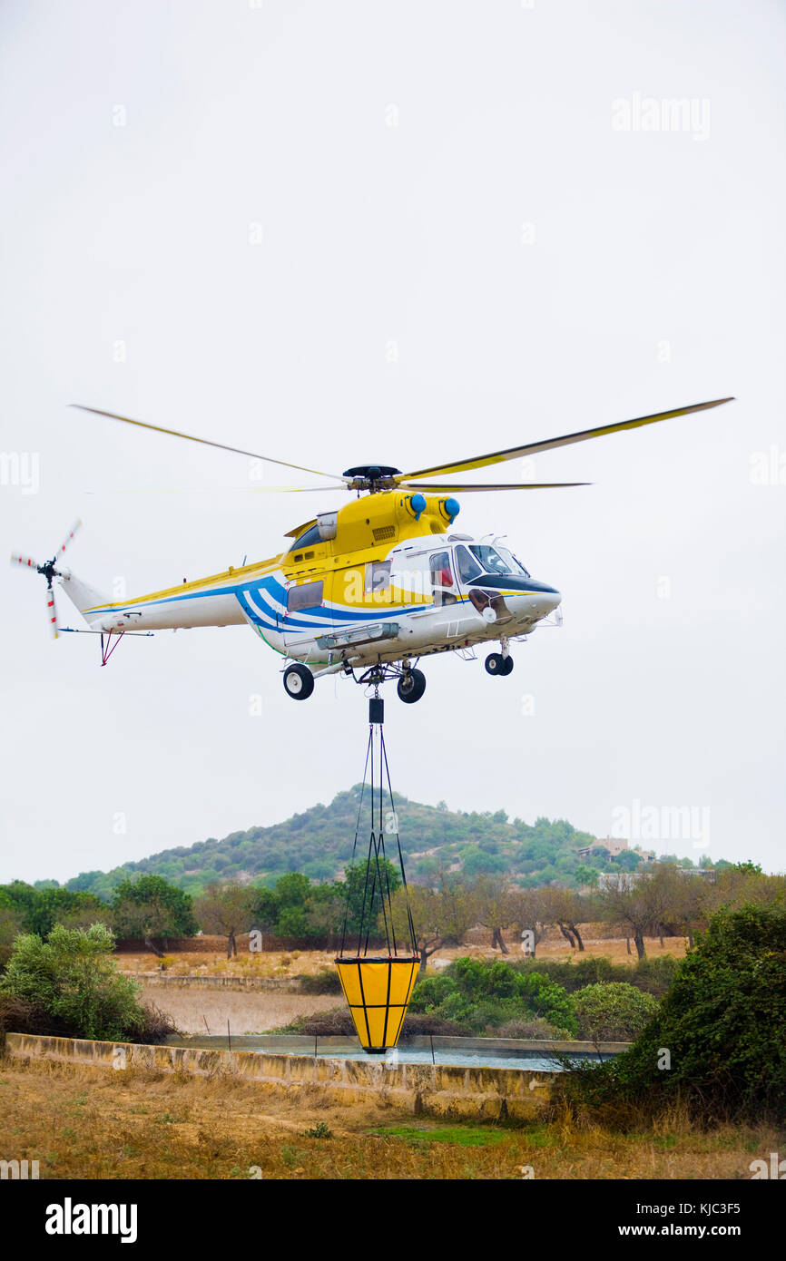 Helicopter Filling Water Container, Cala Ratjada, Capdepera, Mallorca ...