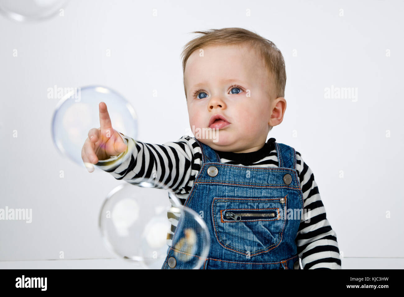 Boy bursting bubbles hi-res stock photography and images - Alamy