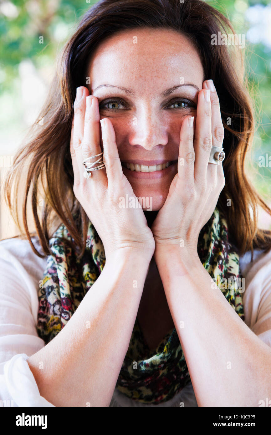 Woman Touching Cheeks Stock Photo - Alamy