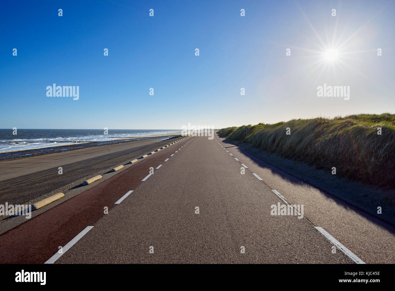 Dike Road with Sun and North Sea, Westkapelle, Zeeland, Netherlands ...