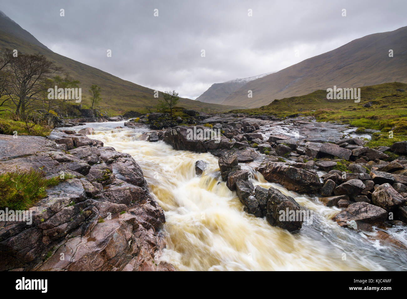 Waterfall on River Coupal with overcast sky at Glen Coe in Scotland ...
