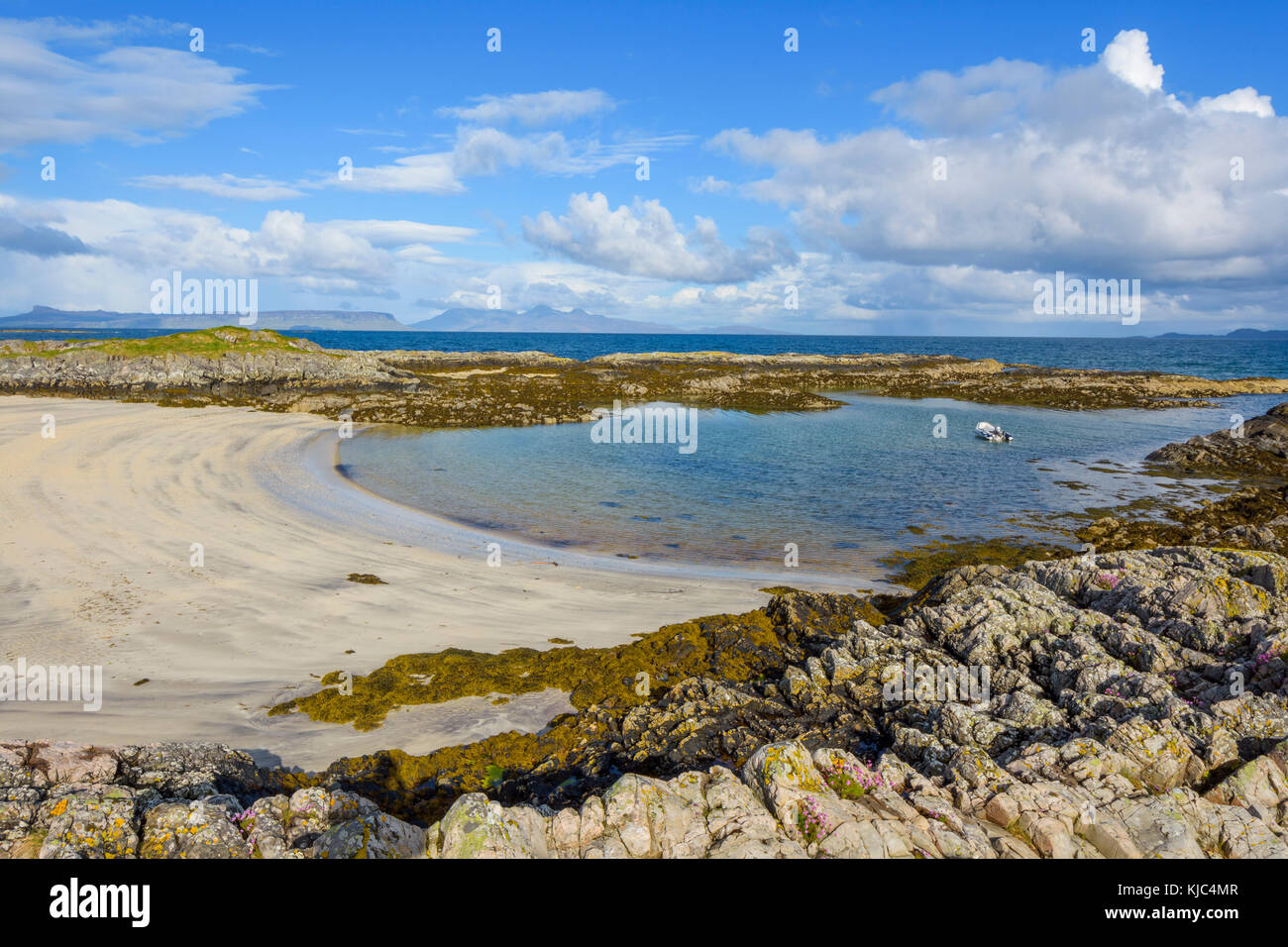 Scottish coast with sandy beach in spring at the port of Mallaig in ...