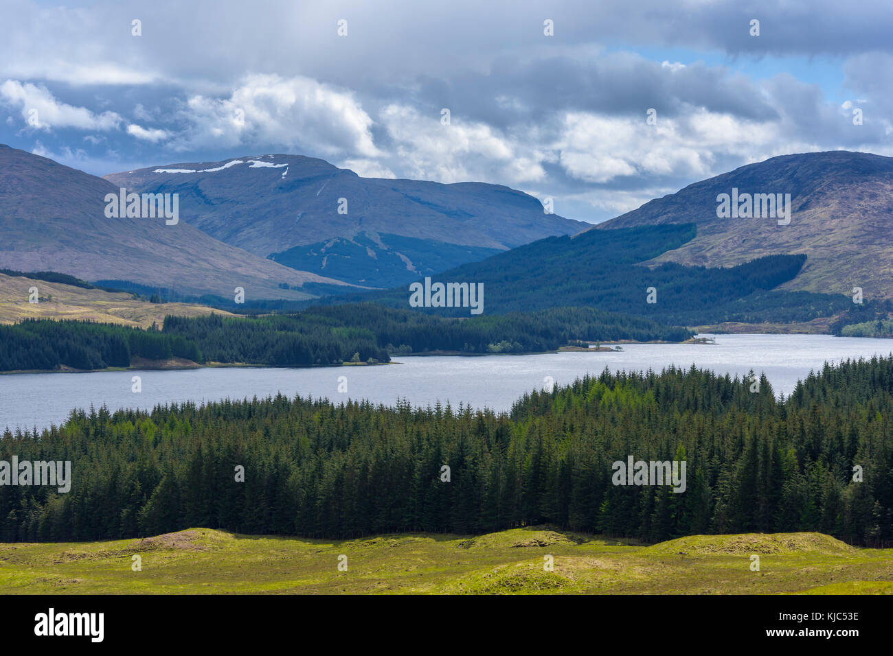 Scenic landscape of hills and a Scottich loch in springtime in Scotland ...