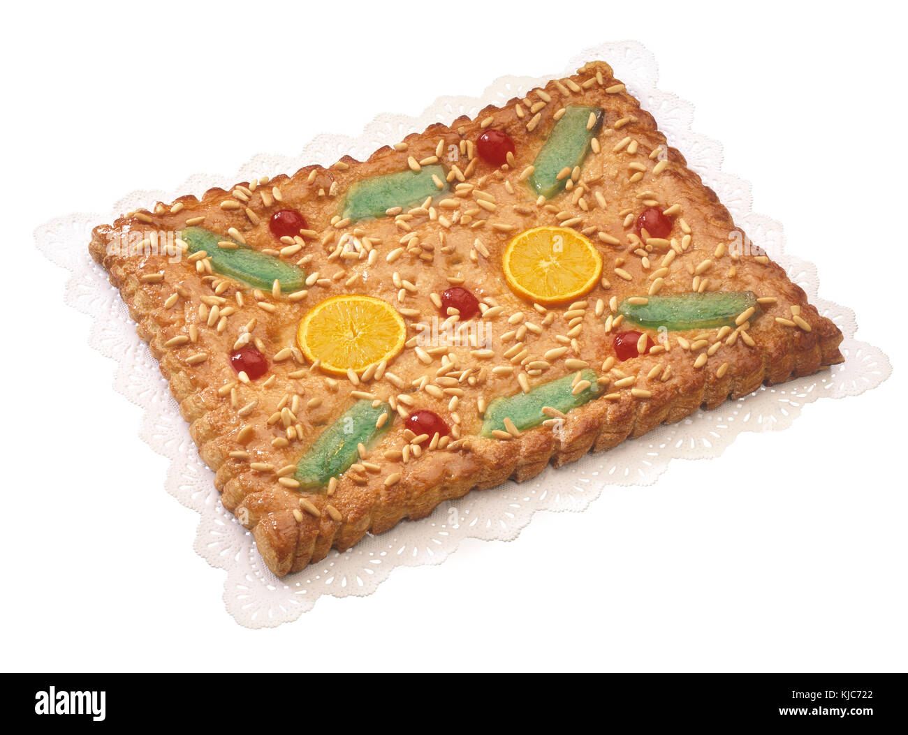 Typical spanish cake with fruits against white background.Clipping path ...