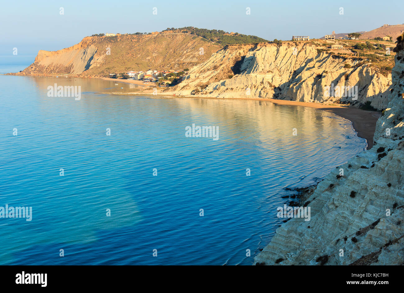 Sandy beach under famed white cliff, called "Scala dei Turchi", in ...