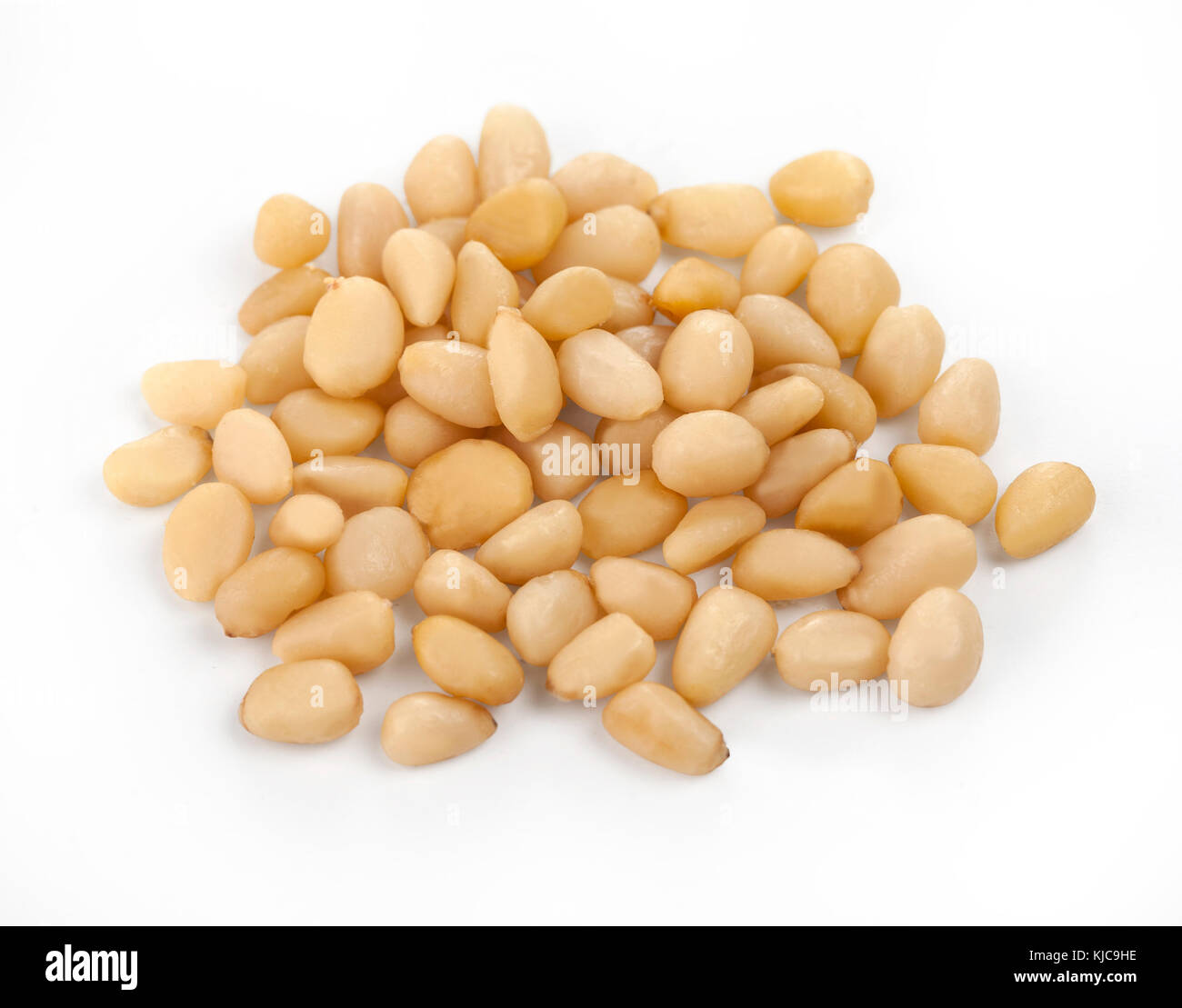 Pine nuts on a white background. with clipping path Stock Photo - Alamy
