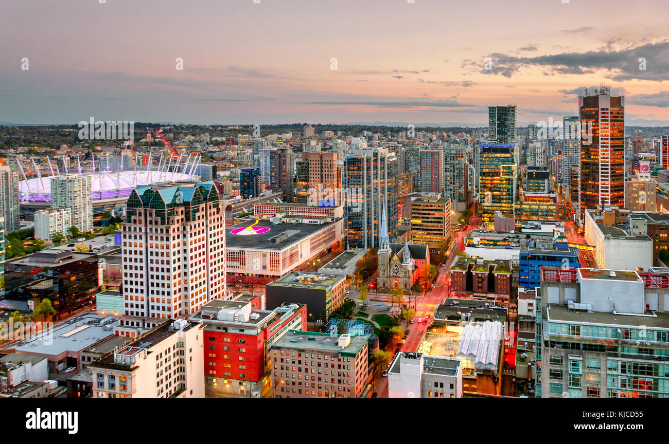 downtown at big city at night with a traffic light, car, buildings and ...