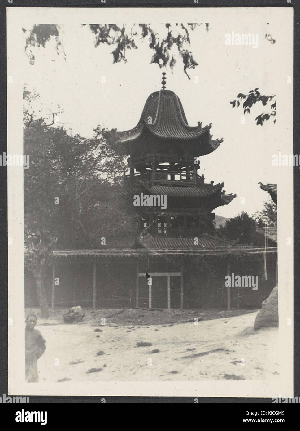 A photograph of a Muslim man standing near the Salar minaret in ...