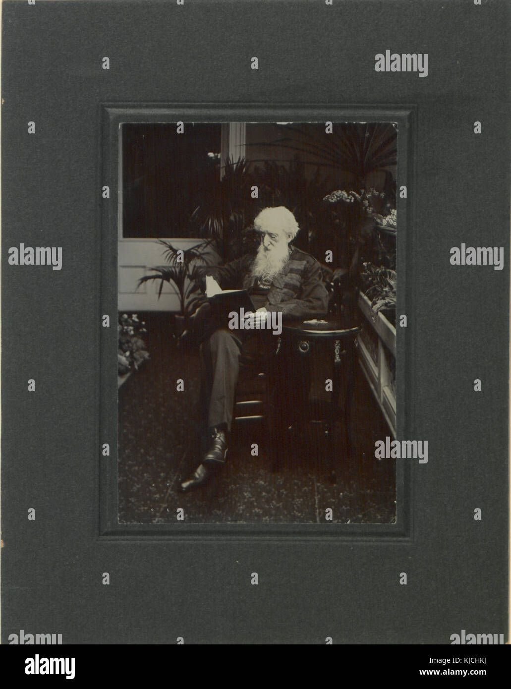 Reverend William Booth, General of the Salvation Army sitting at a ...