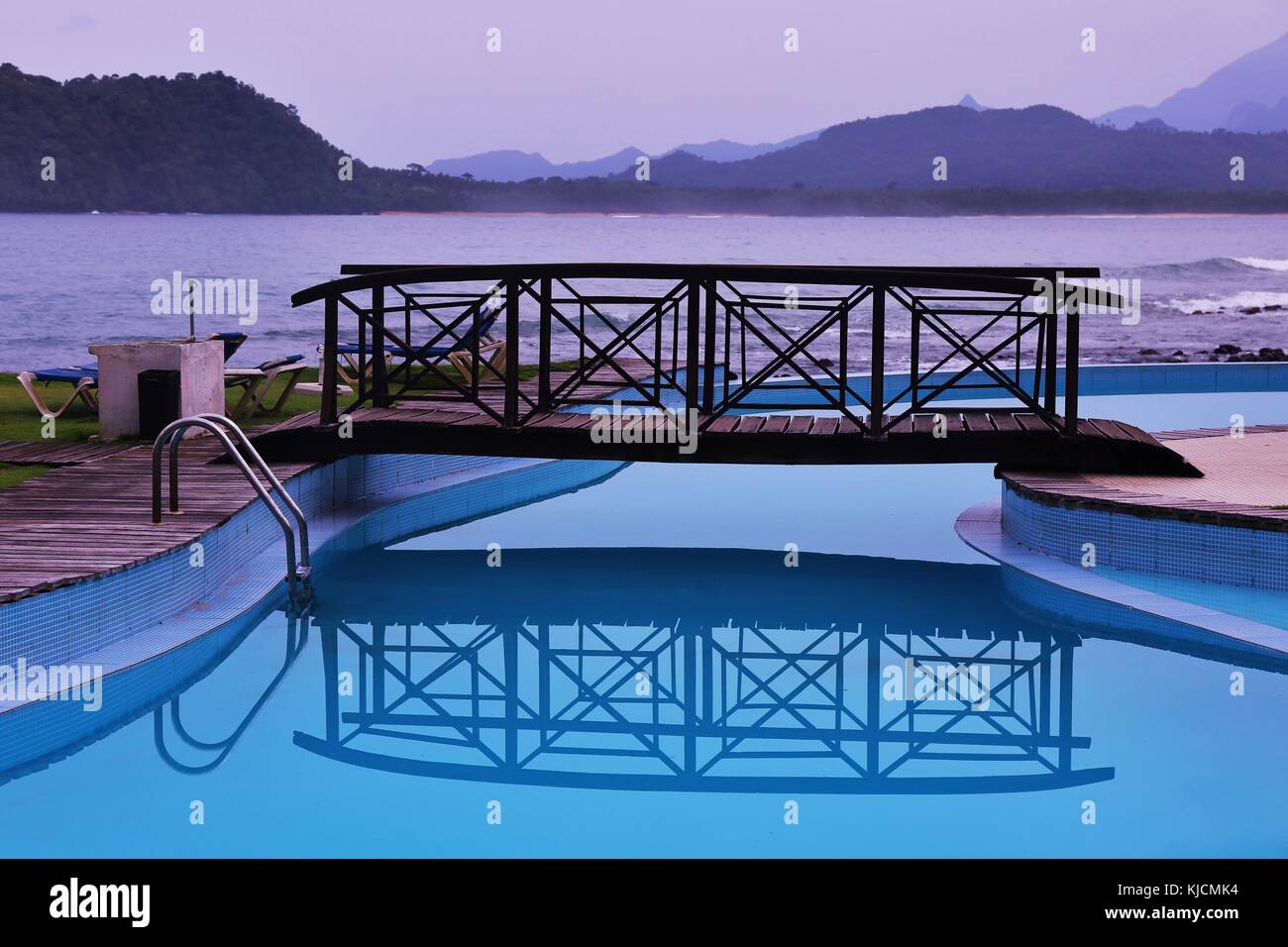 Reflection of a gateway on the water of a swimming pool in a hotel of ...