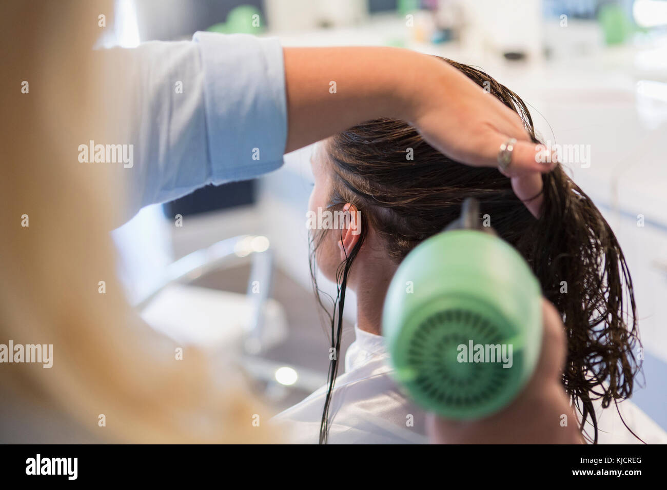 Asian woman drying hair hi-res stock photography and images - Alamy
