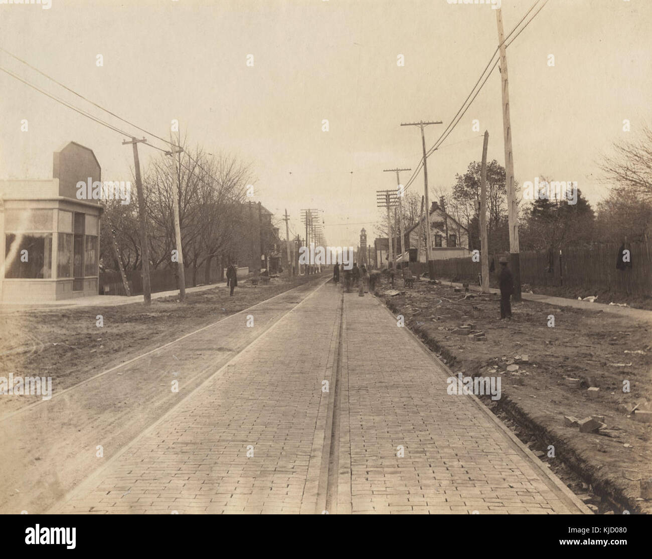 A historical photograph showing the streetcar tracks located on Queen ...