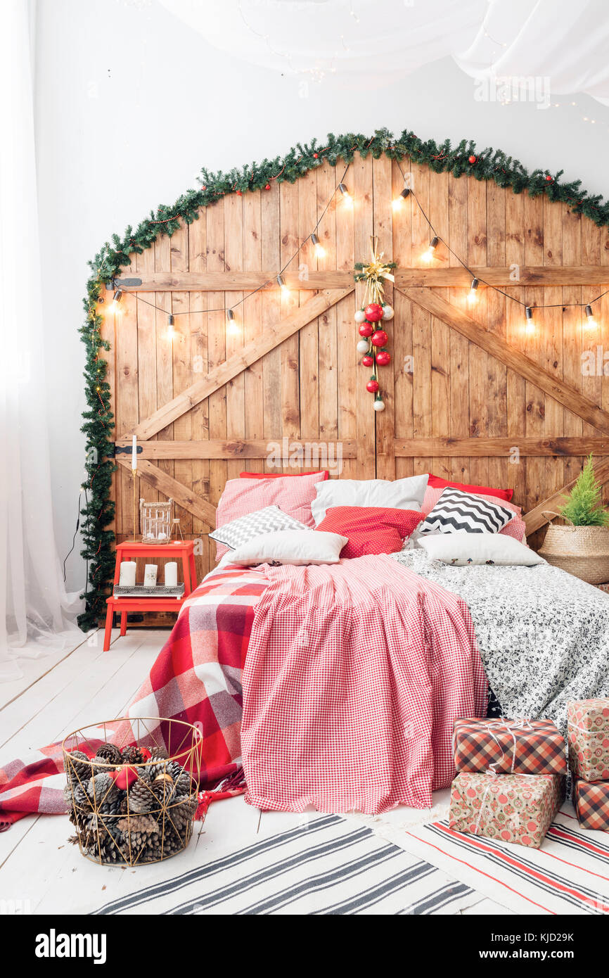 Xmas in morning bedroom. Double bed In christmas Interior on wood wall ...