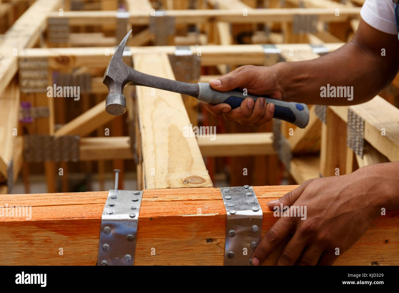 Close up young guy hammering hi-res stock photography and images - Alamy