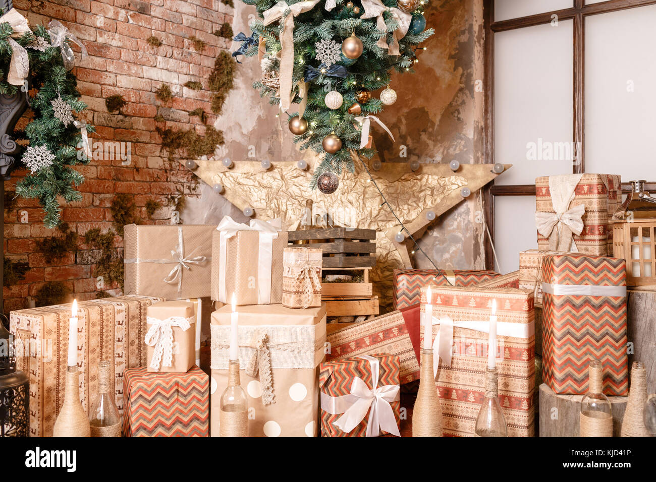 Many Christmas gifts. Winter home decor. Modern loft interior Stock ...