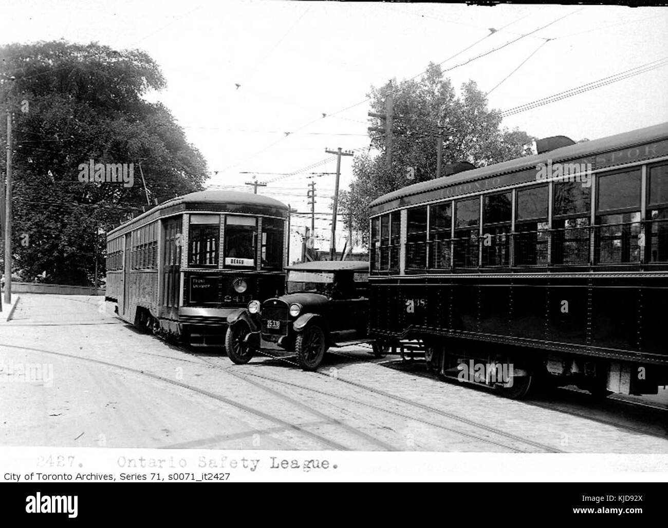Car caught between two TTC Peter Witt streetcars Stock Photo - Alamy