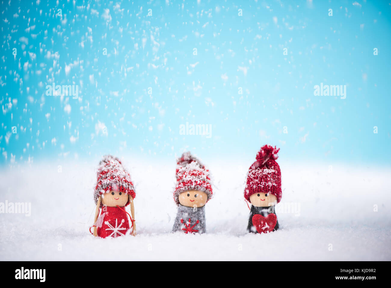Happy kids enjoying snow together Stock Photo - Alamy