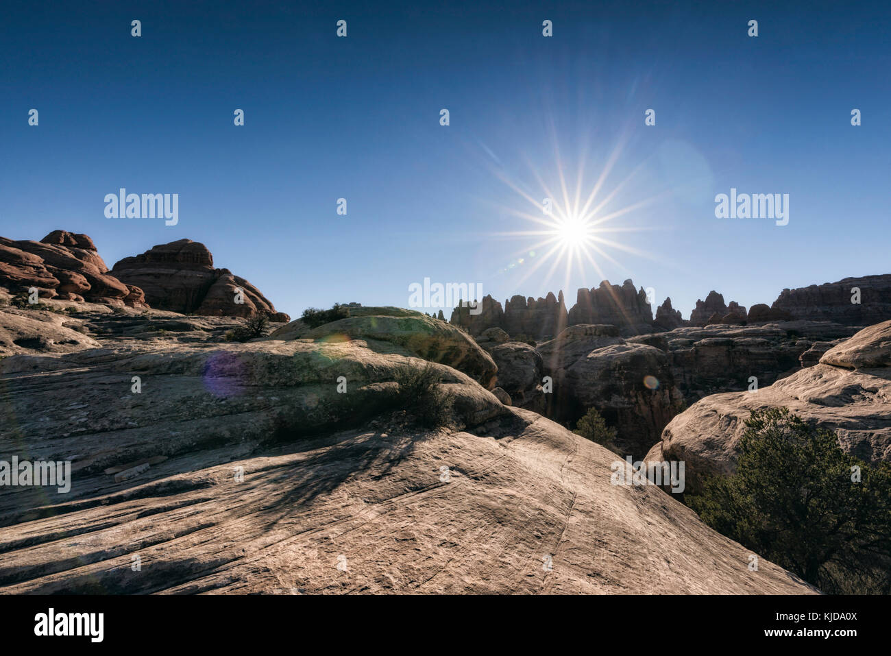 "Sun in blue sky over desert, Moab, Utah, United States Stock Photo - Alamy