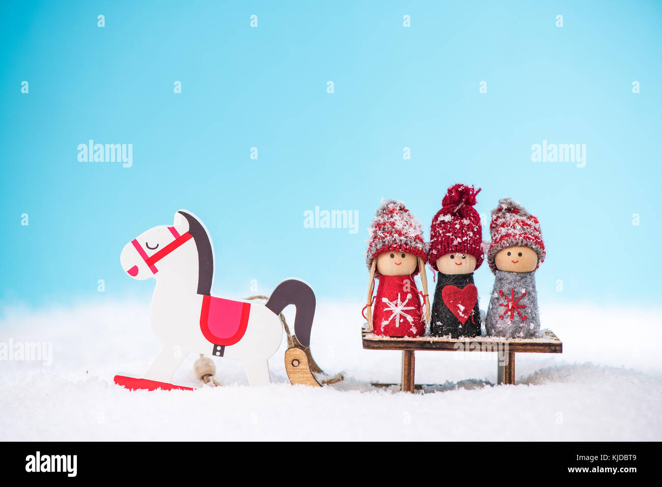 Happy and funny kids on snow sledge Stock Photo - Alamy