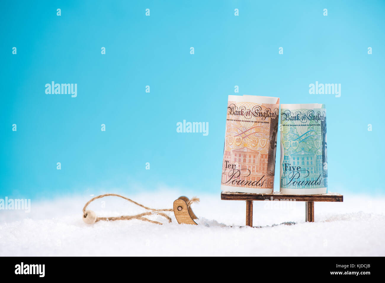 British pounds on snow sledge Stock Photo - Alamy