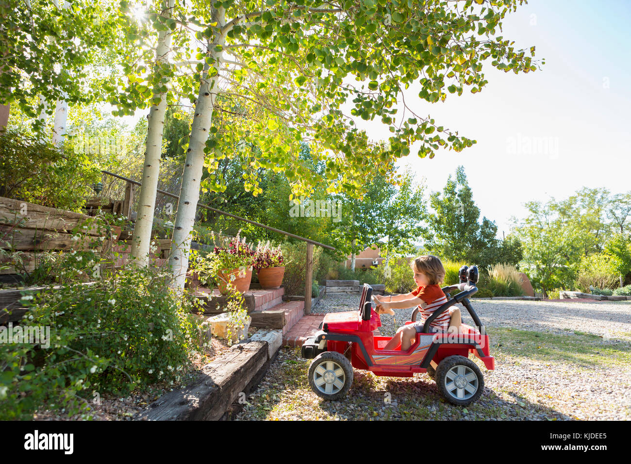 Caucasian boy driving toy car Stock Photo - Alamy