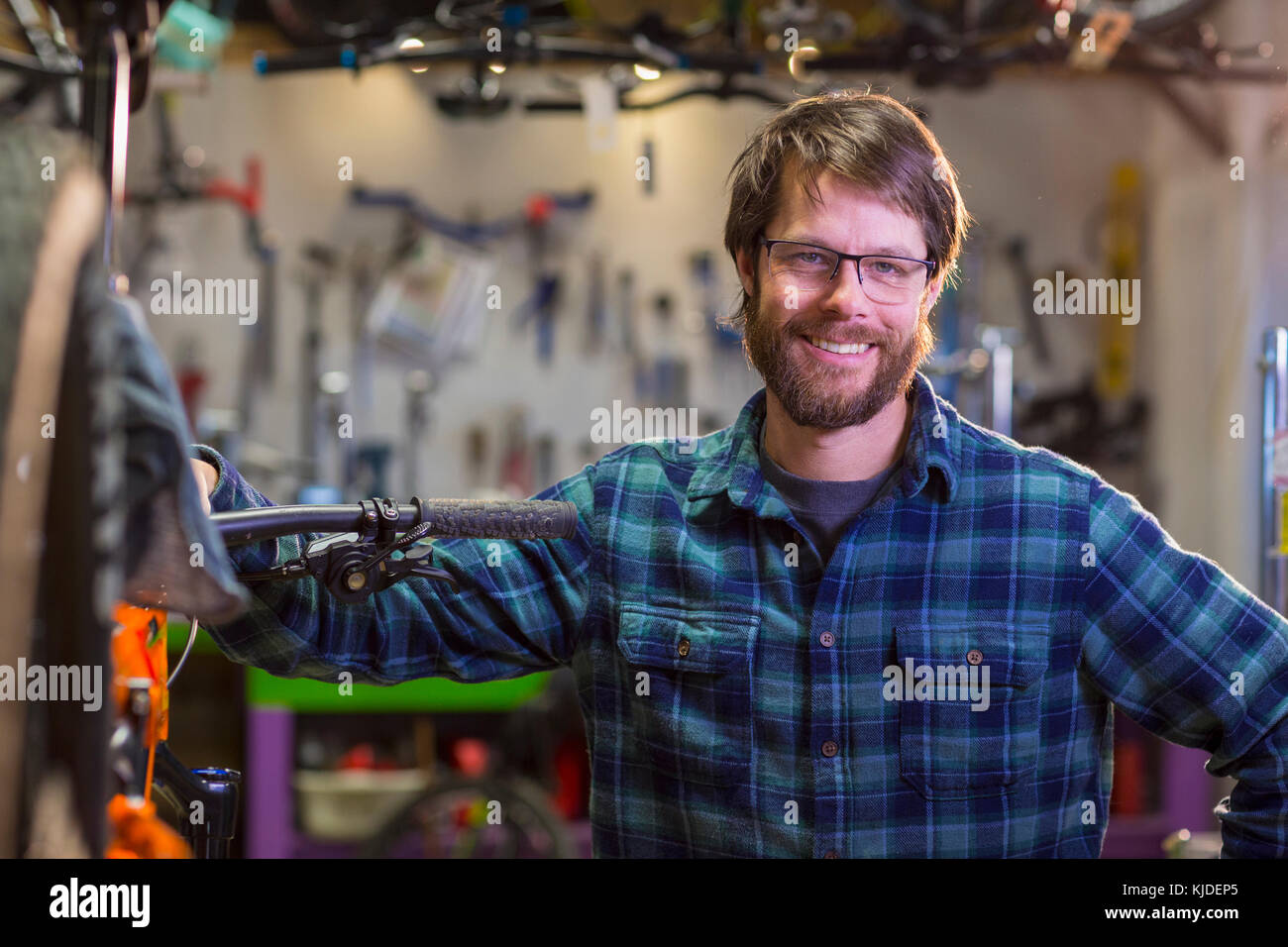 Man in bicycle shop hi-res stock photography and images - Alamy