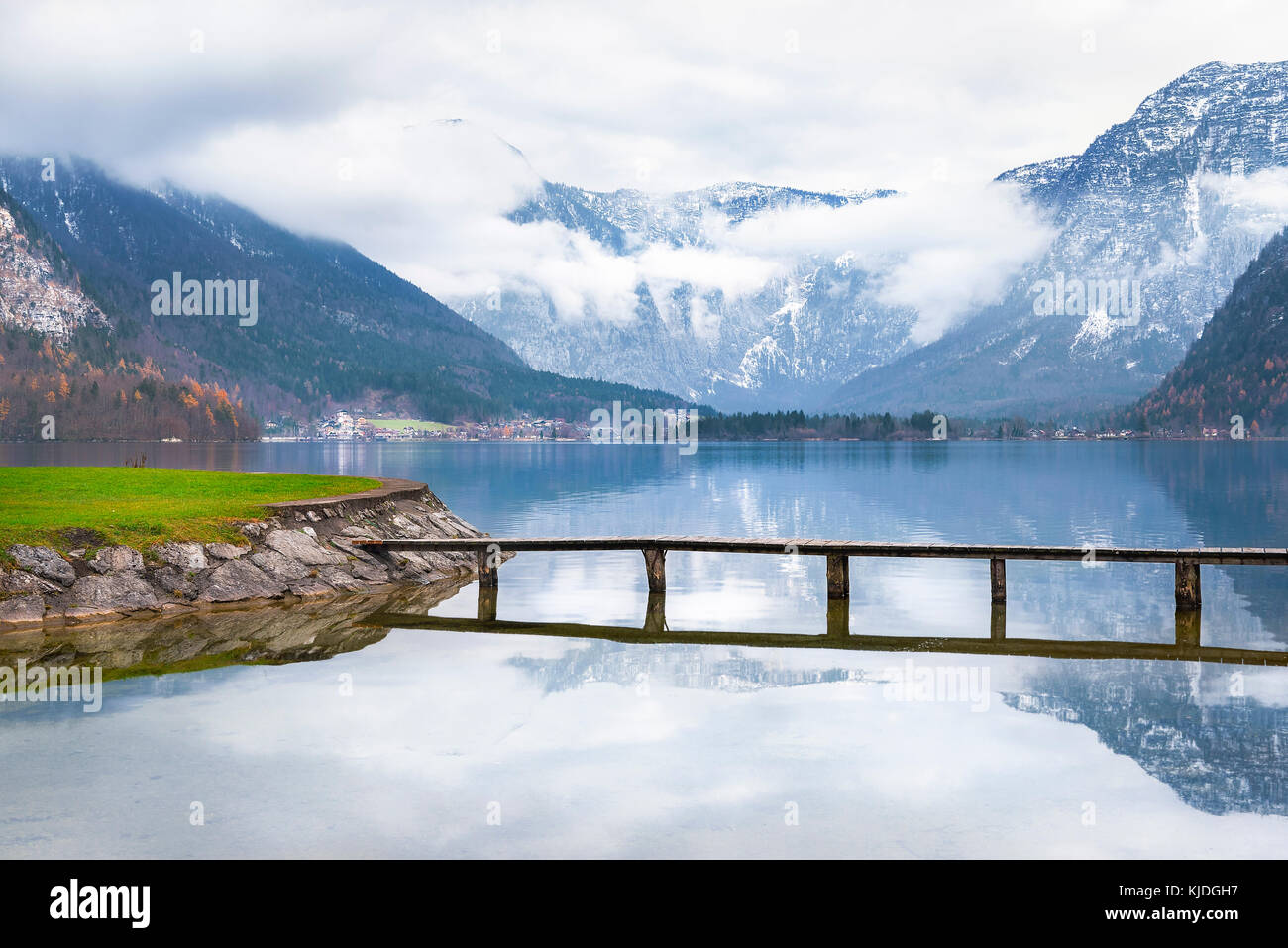 Trip idea theme image with the Hallstatter lake, a small bridge that ...