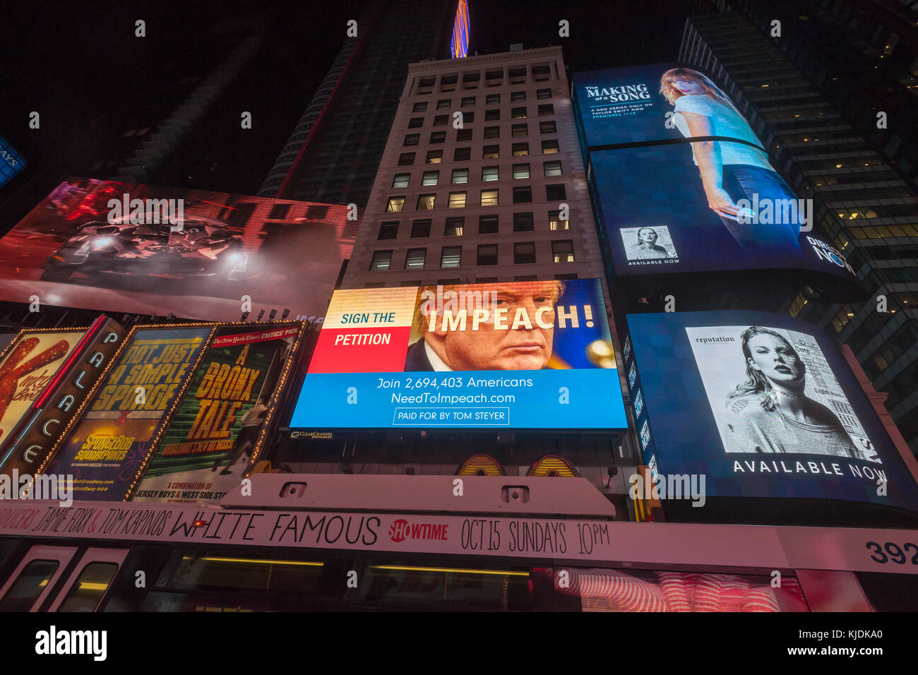 Electronic billboards in Times Square in New York show "Impeach Trump ...