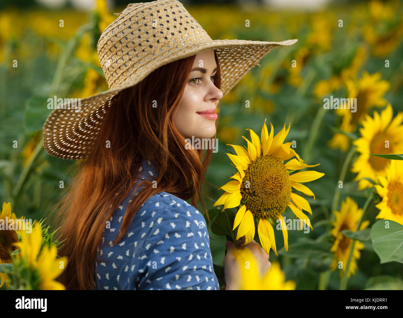 Woman wearing sunflower hat hi-res stock photography and images - Alamy