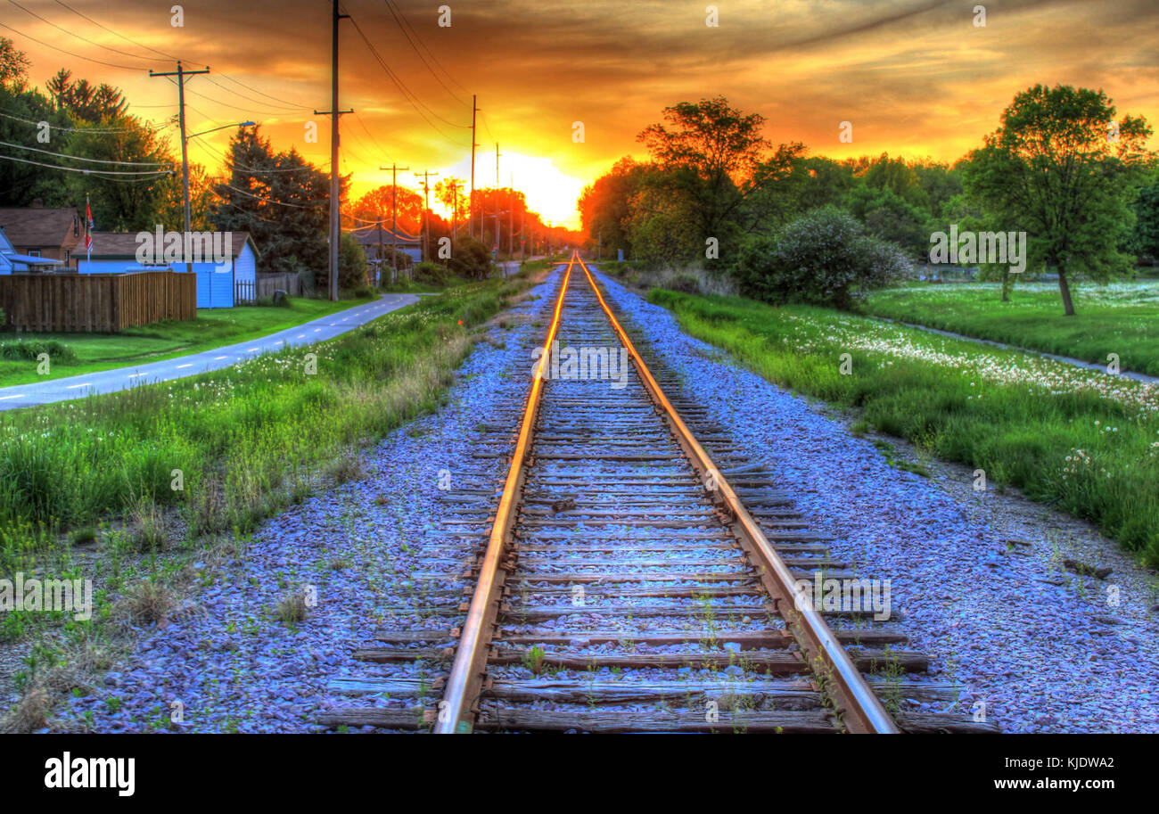 The image shows a train traveling along the Southern Wisconsin Railroad ...