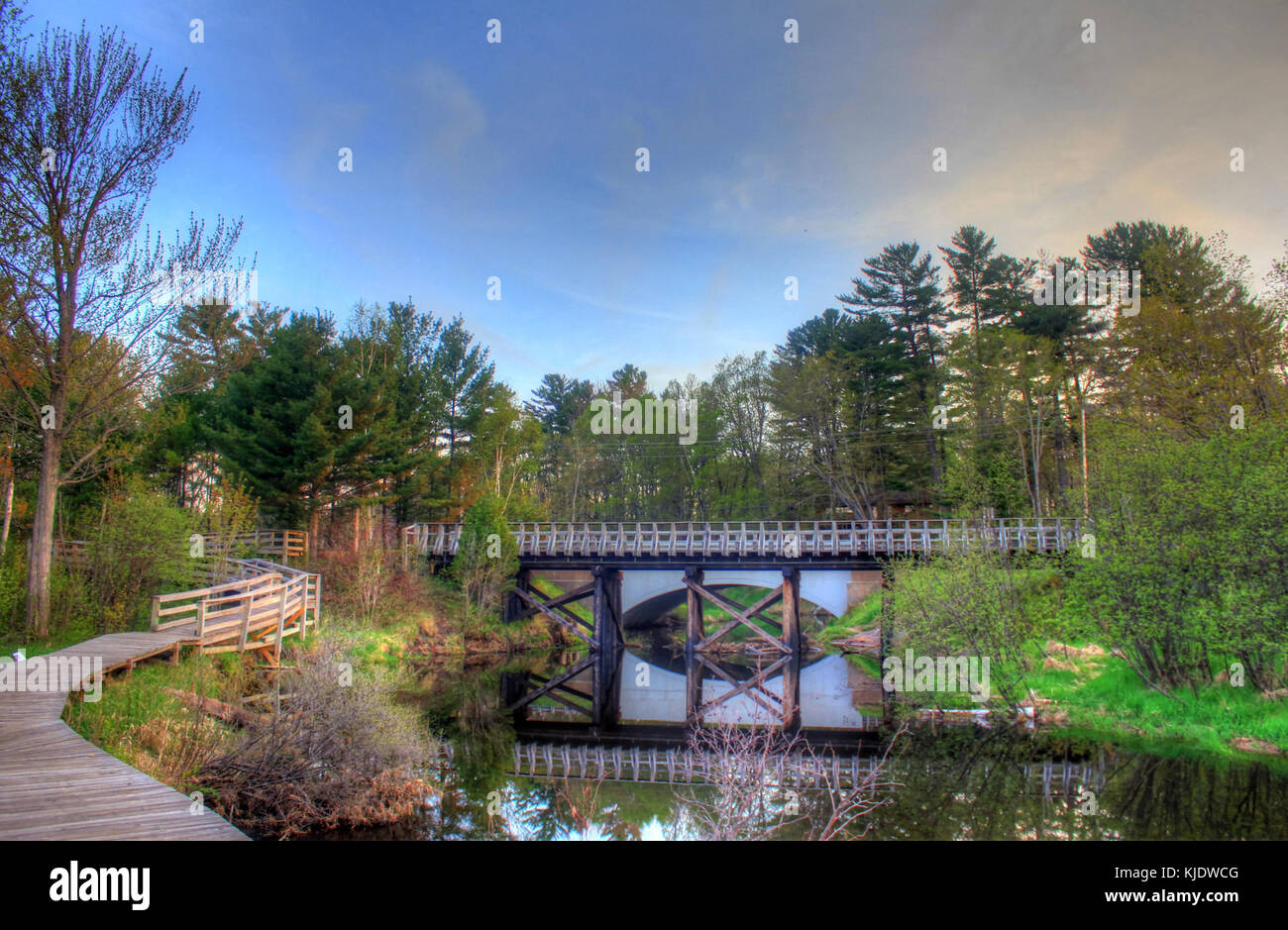 Gfp michigan upper peninsula bridge spanning the stream Stock Photo - Alamy
