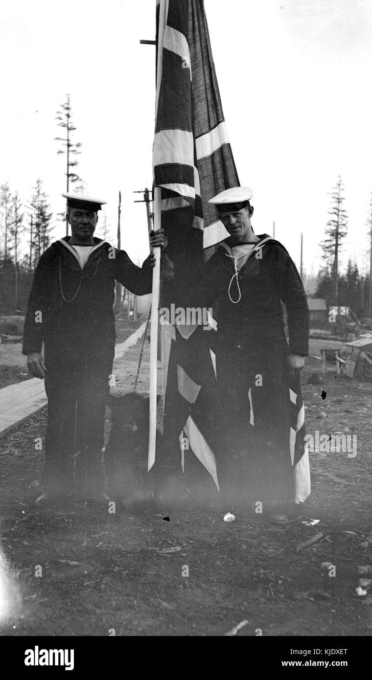 This image from 1912 shows sailors from the HMCS Rainbow with a bear ...