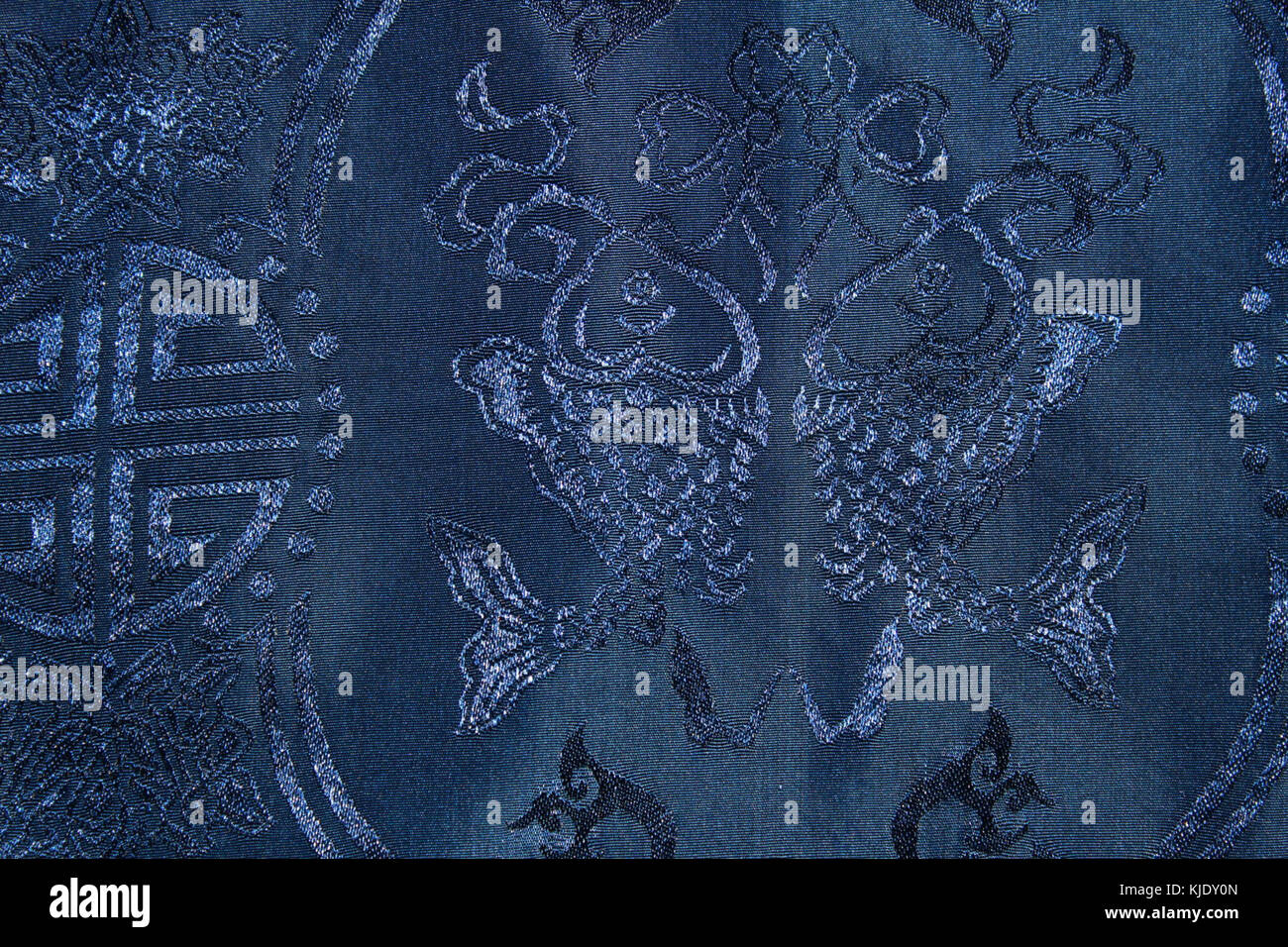 This fabric features a traditional Chinese design in blue, often used ...