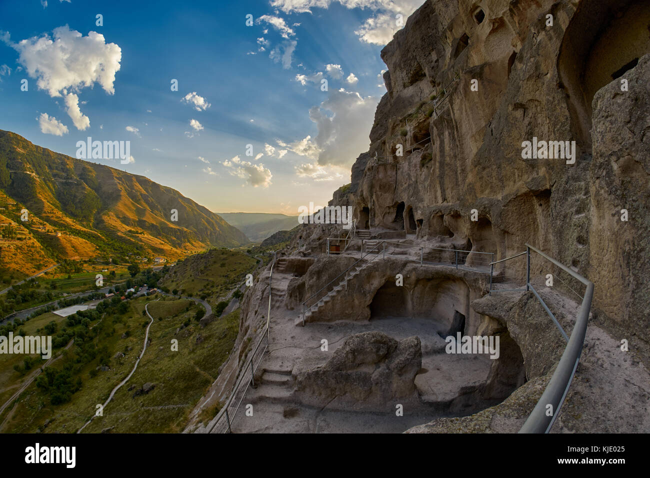 Climbing multiple steps of famous Vardzia Cave city in Georgia Stock ...