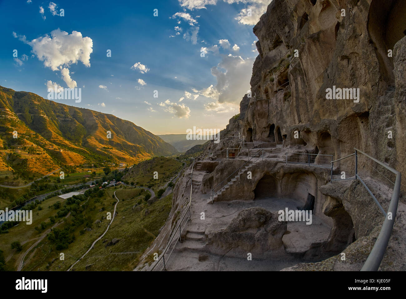 Climbing multiple steps of famous Vardzia Cave city in Georgia Stock ...