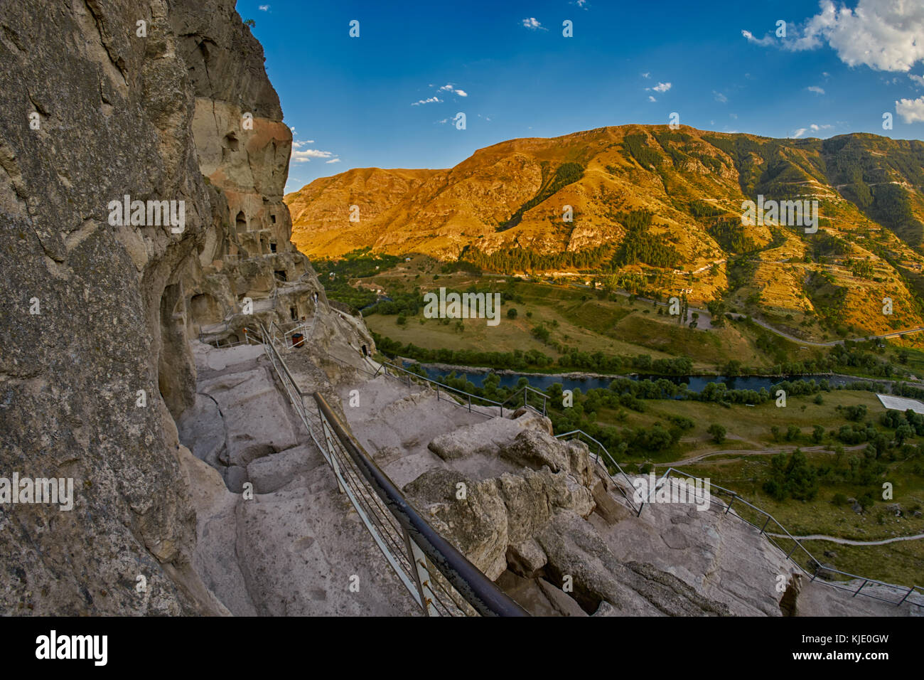 Climbing multiple steps of famous Vardzia Cave city in Georgia Stock ...
