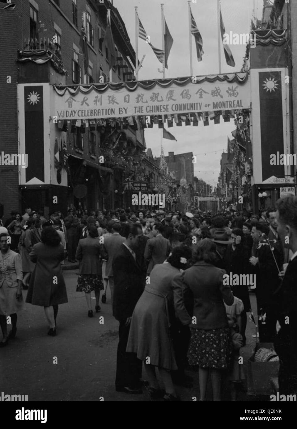 This photograph captures a vibrant Chinatown parade, showcasing the celebration of cultural ...