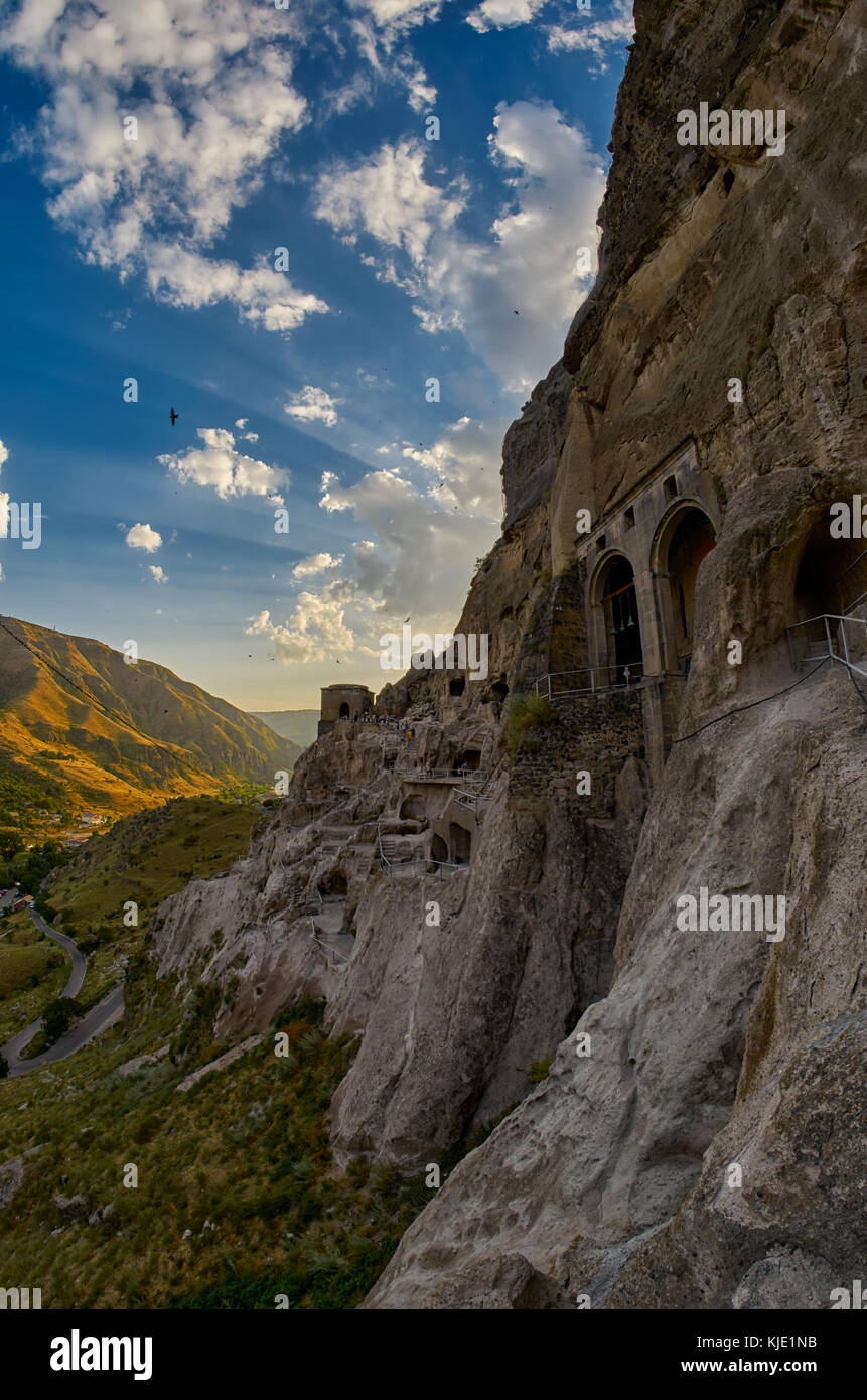 Climbing multiple steps of famous Vardzia Cave city in Georgia Stock ...