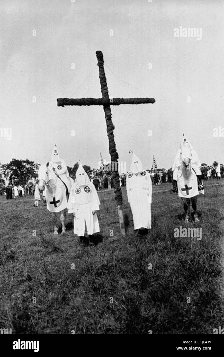 Ku Klux Klan with cross at a gathering near Kingston, Ontario in 1927 ...