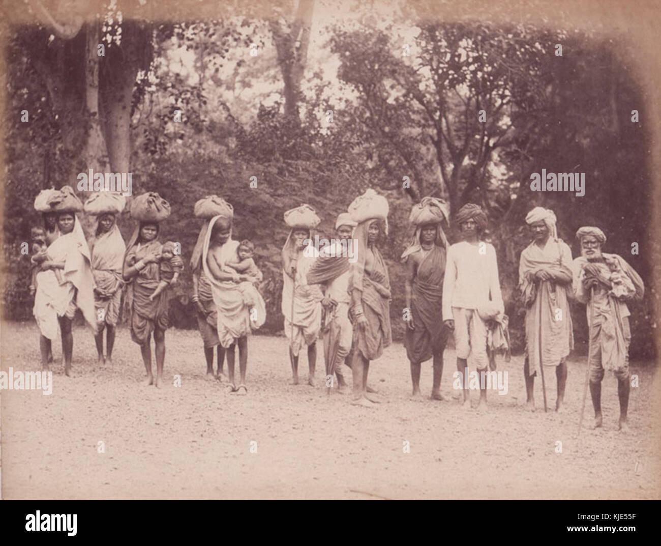Natives of Central India carrying small packs on their head (unknown ...