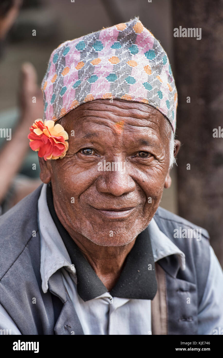Man in nepali traditional hat hi-res stock photography and images - Alamy