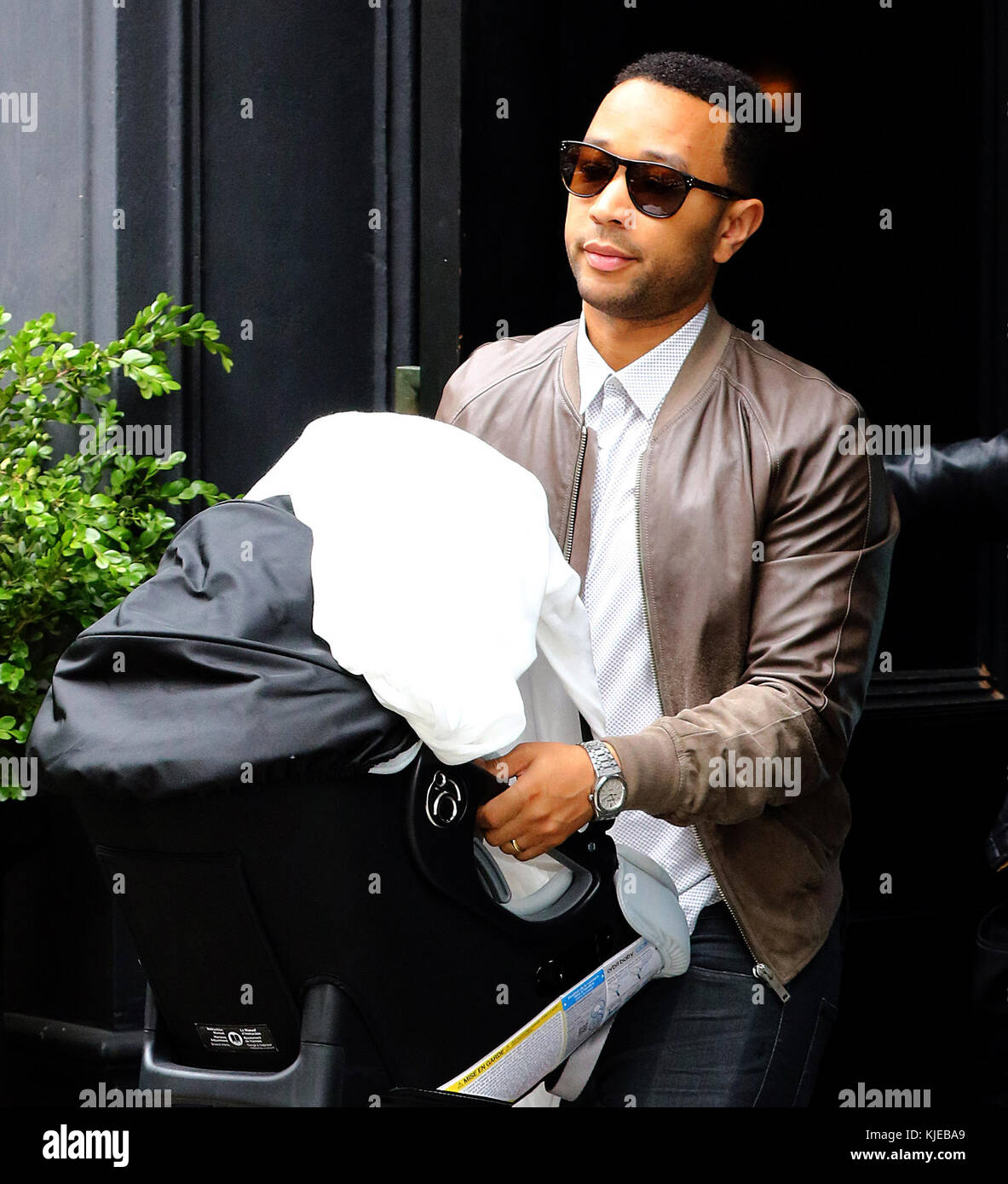 NEW YORK, NY - MAY 17: John Legend and new daughter Luna as they leave ...