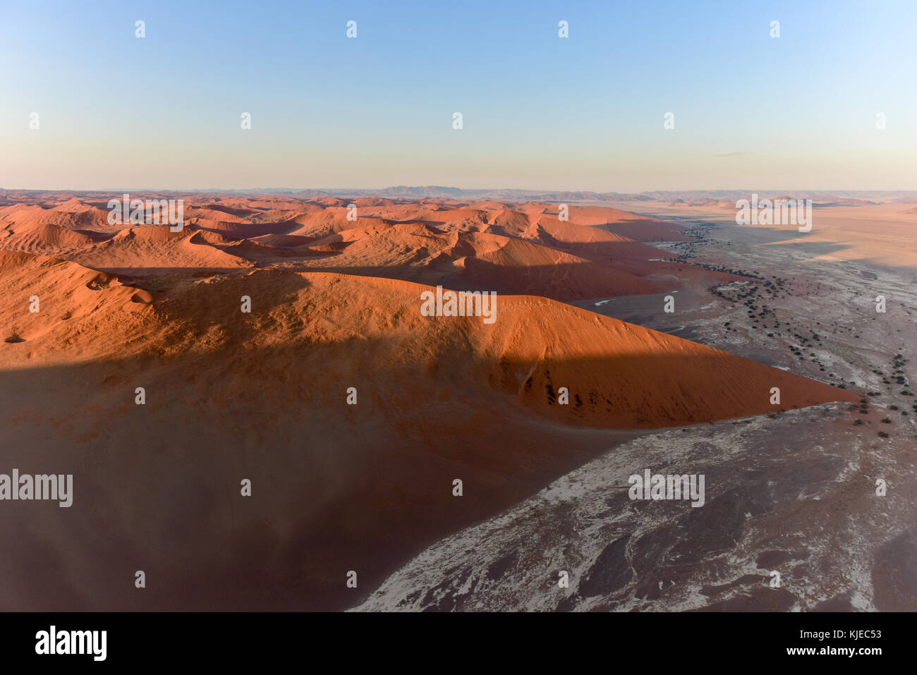 Aerial view of high red dunes, located in the Namib Desert, in the Namib-Naukluft National Park ...
