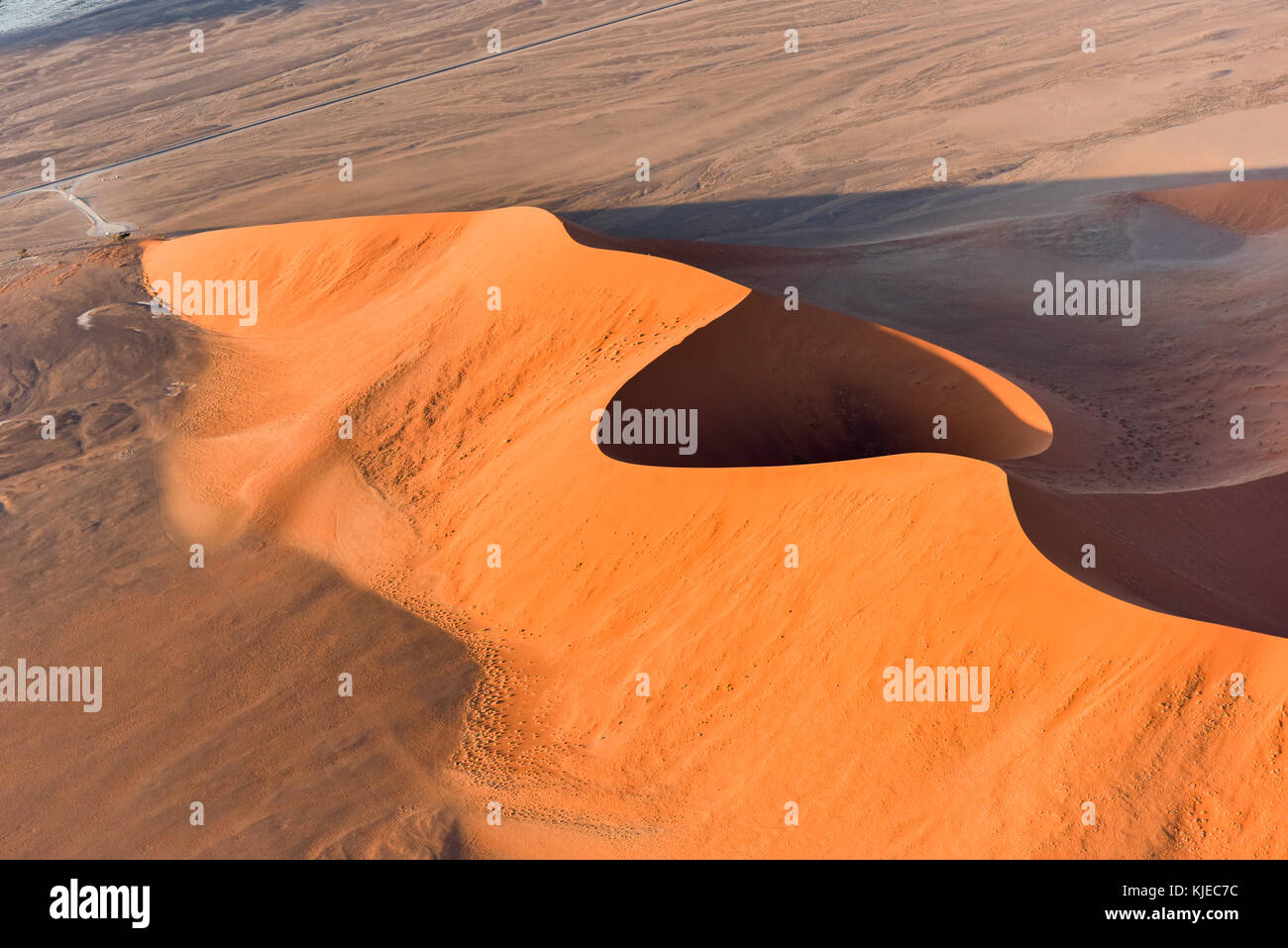 Aerial view of high red dunes, located in the Namib Desert, in the Namib-Naukluft National Park ...