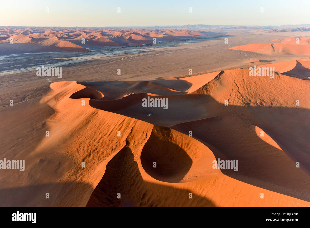 Aerial view of high red dunes, located in the Namib Desert, in the Namib-Naukluft National Park ...