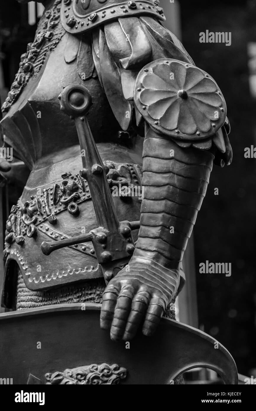 Hand in armour of the medieval knight statue Stock Photo - Alamy
