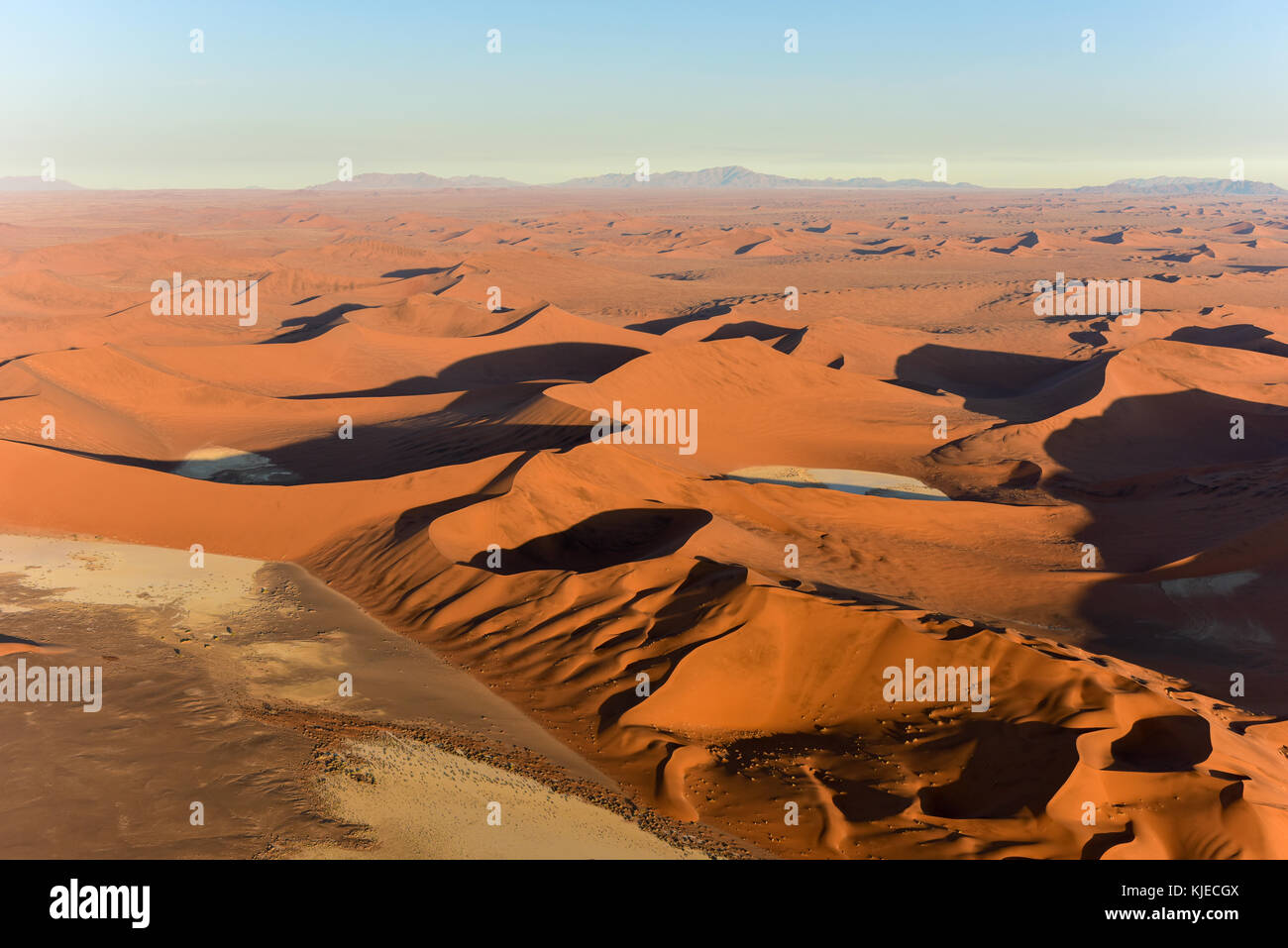 Aerial view of high red dunes, located in the Namib Desert, in the Namib-Naukluft National Park ...