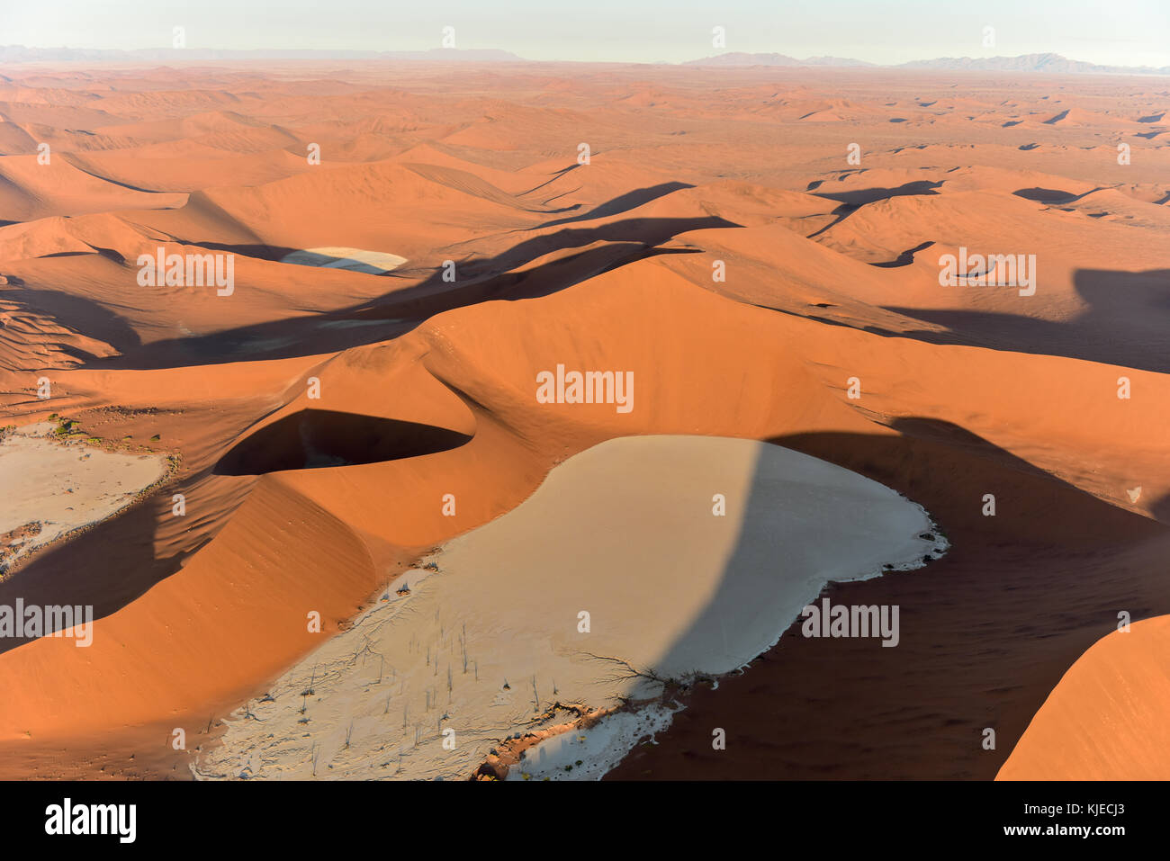 Aerial view of high red dunes, located in the Namib Desert, in the Namib-Naukluft National Park ...